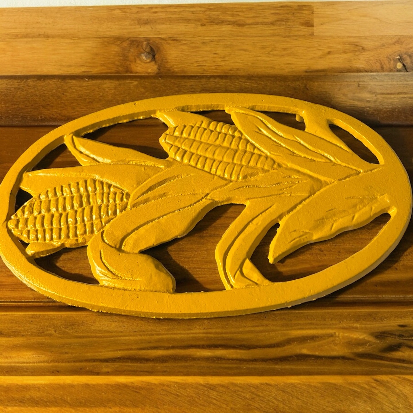 053b. Yellow Corn Cast Iron Trivet