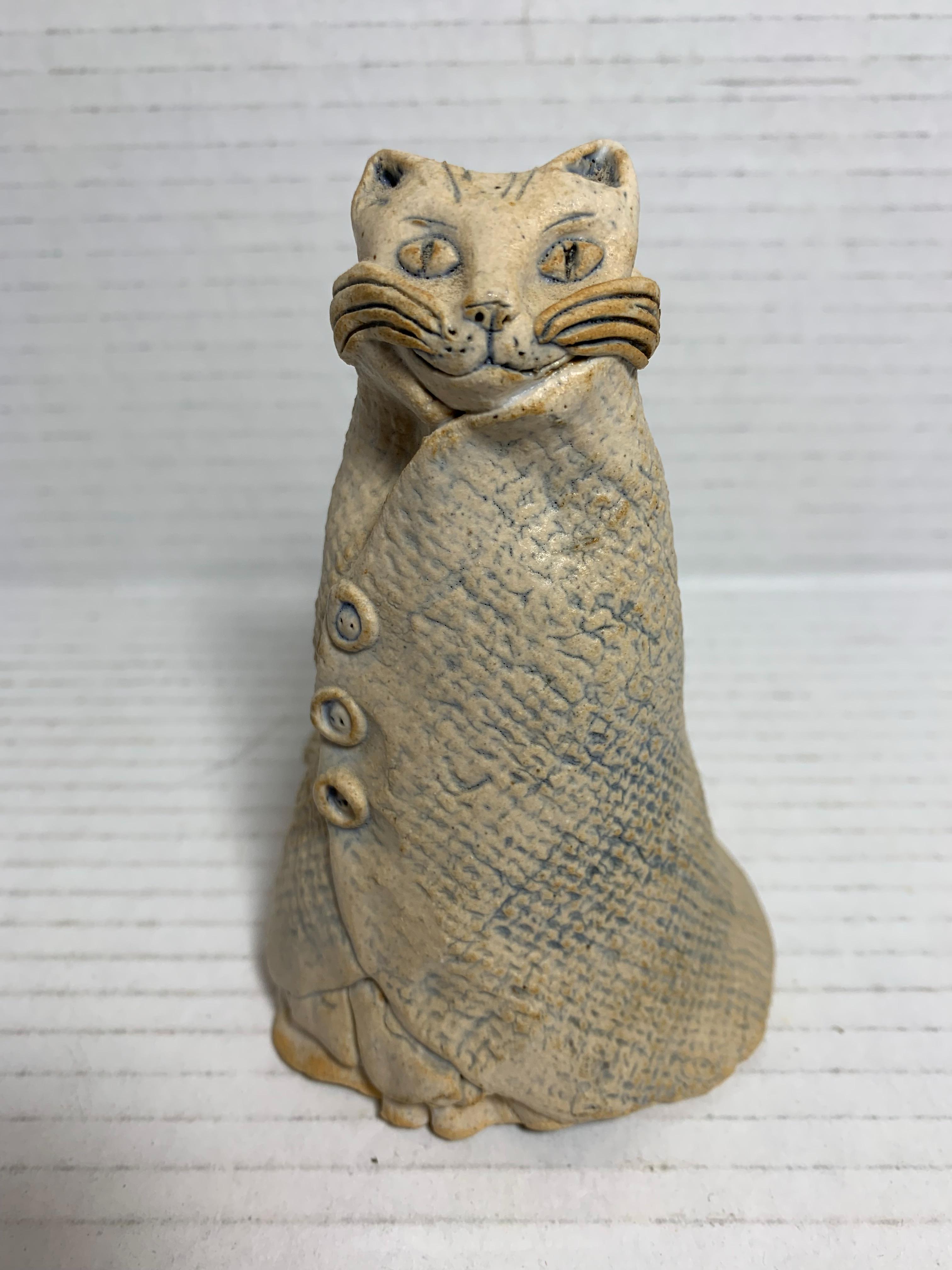 Handmade cat in a blanket pottery figurine. Signed K.A.R.