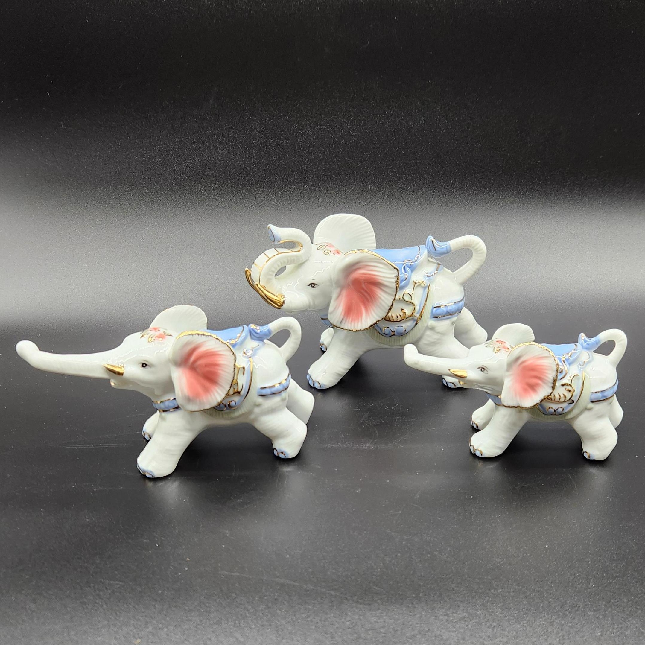 Vintage Porcelain Elephant Figurine Trio with Gold Accents
