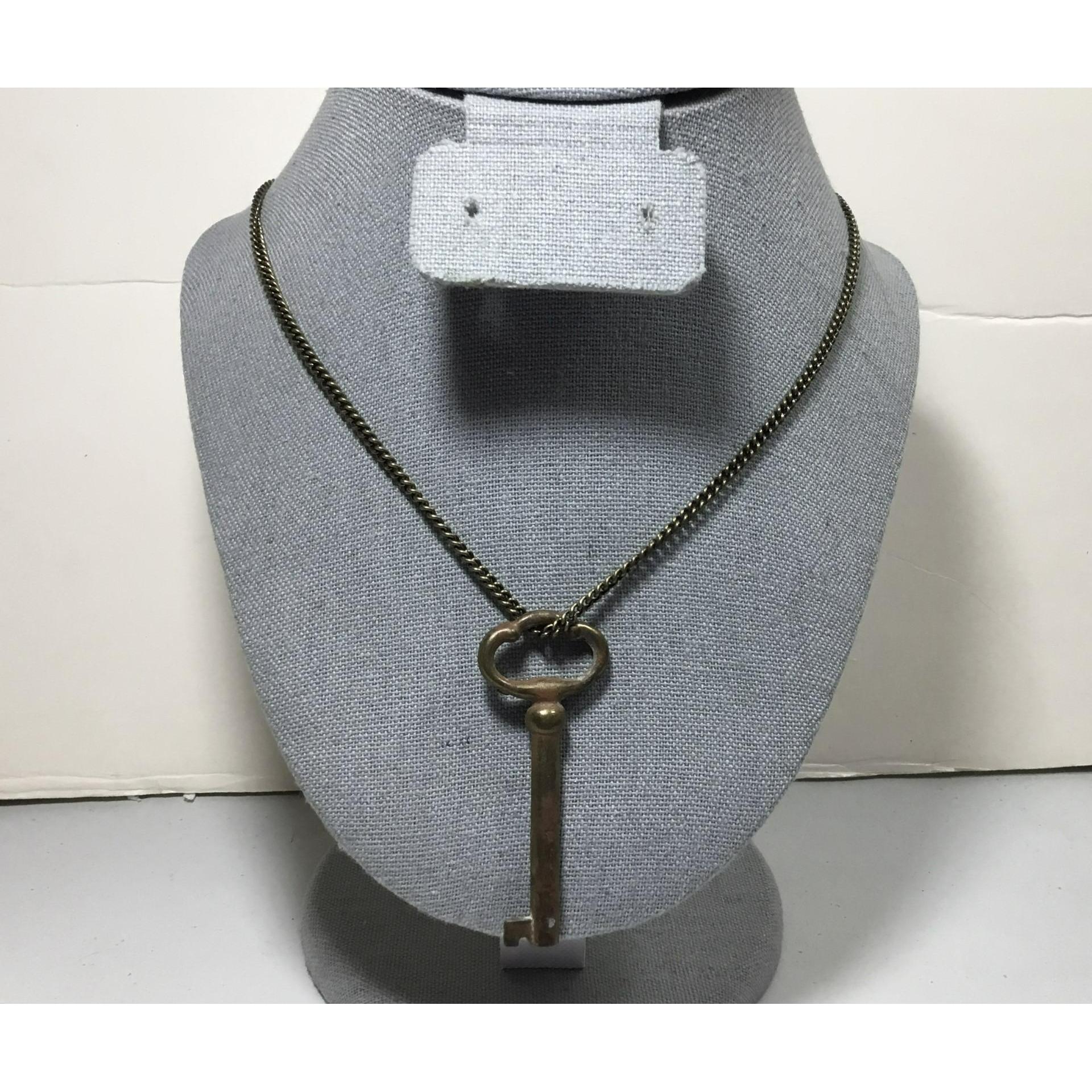 Antique brass key on modern brass tone 22" chain